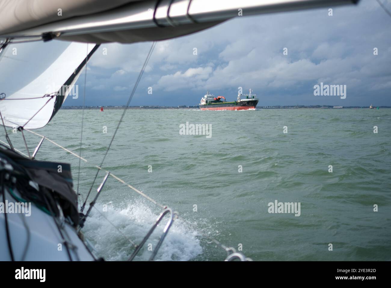 Sailing close to a shipping port with a tanker, container ship. Near to ...