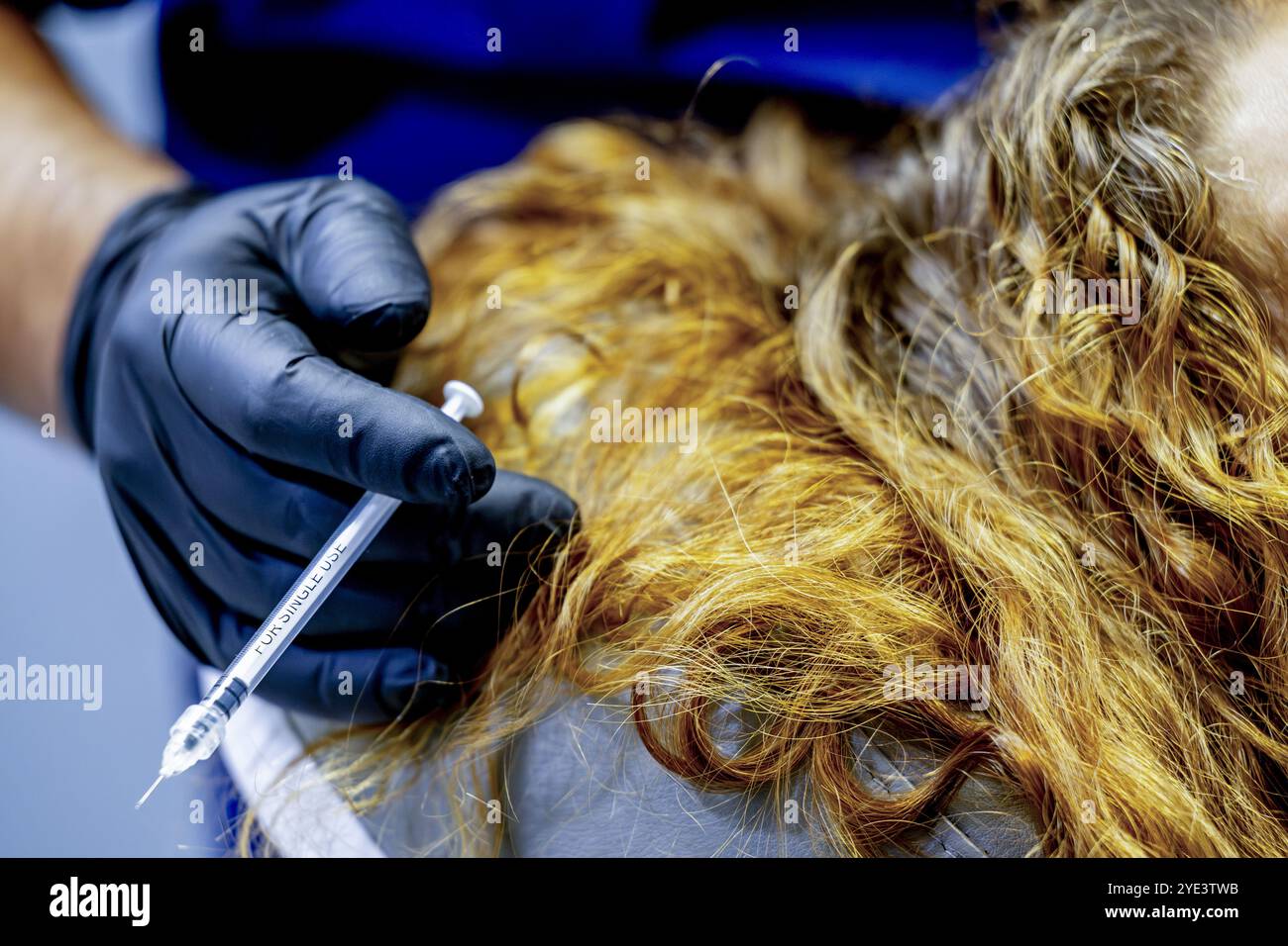 ROTTERDAM - An injection needle with botox at a botox clinic. More and ...