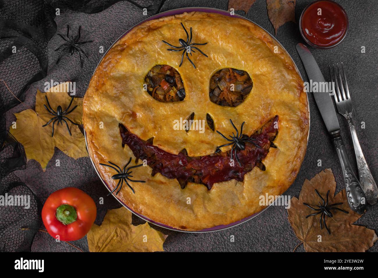 Halloween homemade vegetables pie with scary face. Autumn theme Top ...