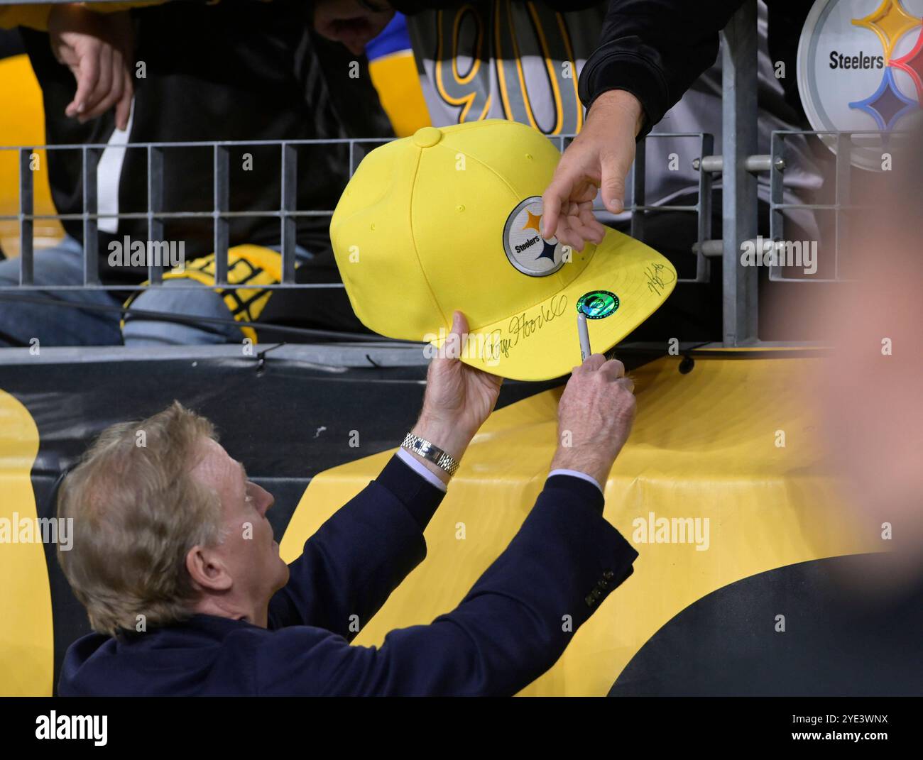 Roger Goodell, Commissioner of the National Football League signs an ...