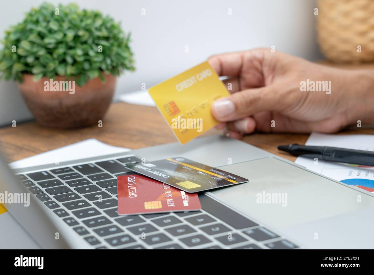 Man using credit card and laptop for online shopping Stock Photo - Alamy