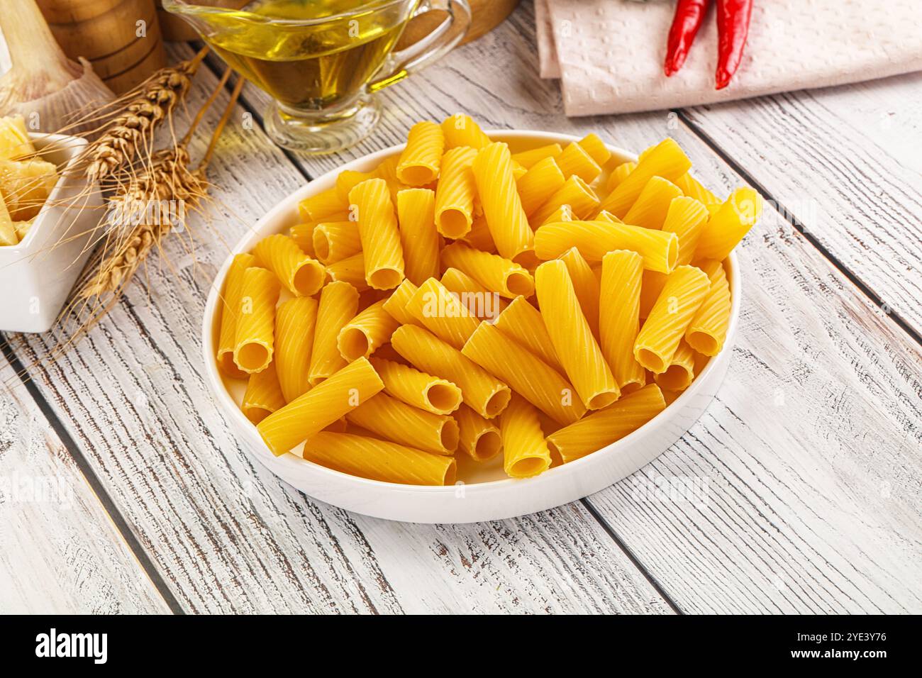 Italian cuisine - raw dry tortiglioni pasta Stock Photo - Alamy