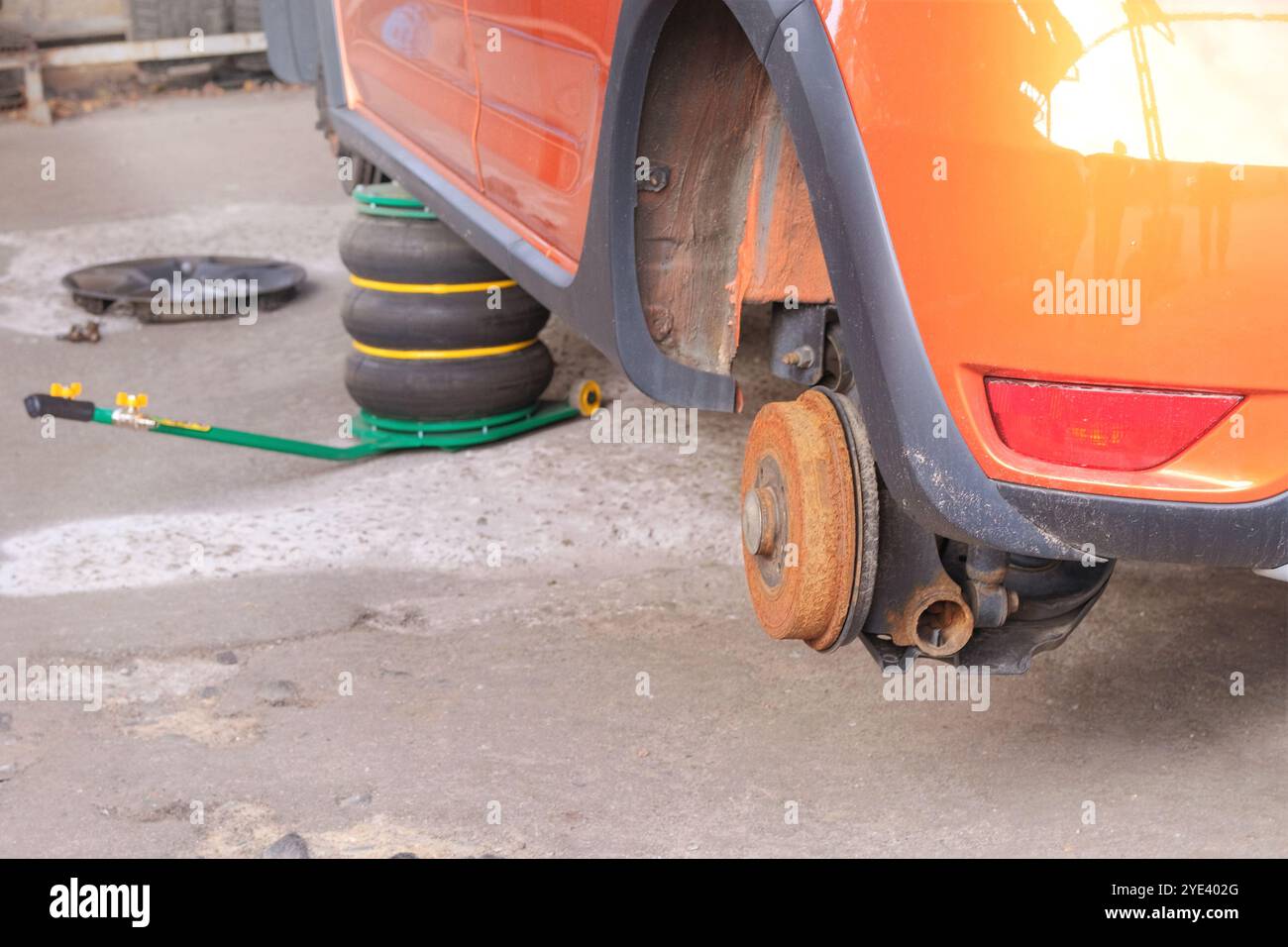 Car repair. Wheel balancing or repair and change auto tire. Technicians ...