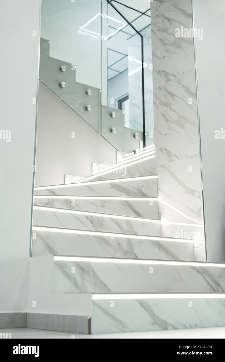 Elegant marble staircase with LED lighting in a modern interior setting ...