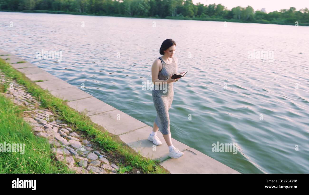 Woman enjoying river scene sunset hi-res stock photography and images ...