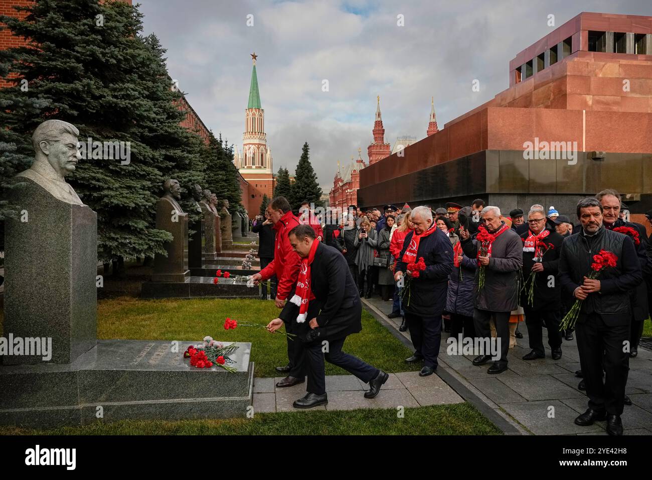 Communist Party officials and supporters lay flowers at the grave of ...