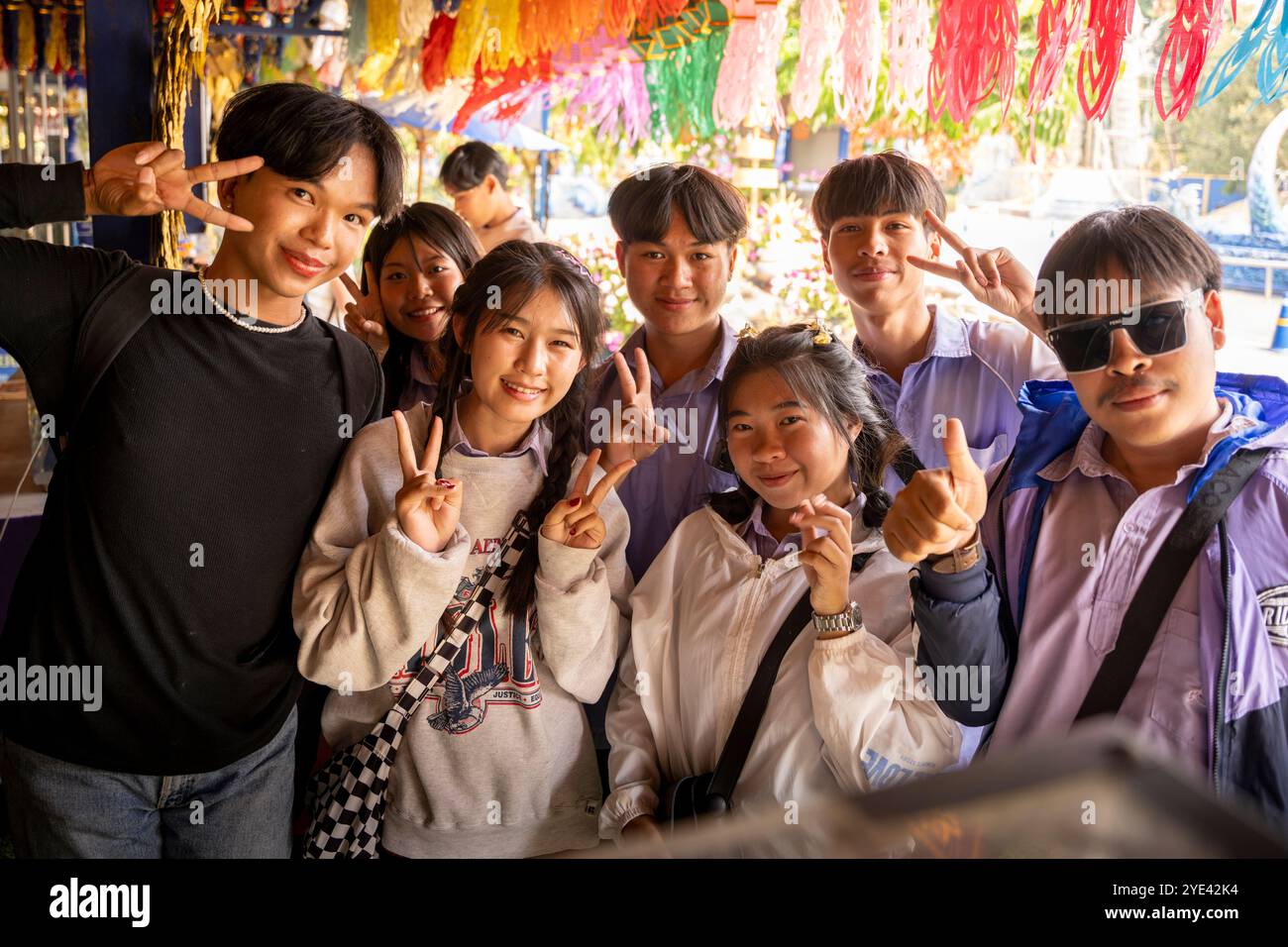 A joyful group of Thai students and their teacher visiting the Blue ...
