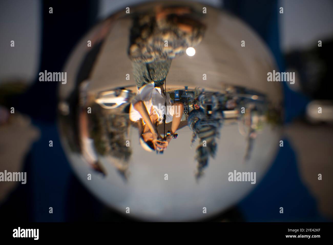A unique reflection captures a visitor photographing the Blue Temple in ...