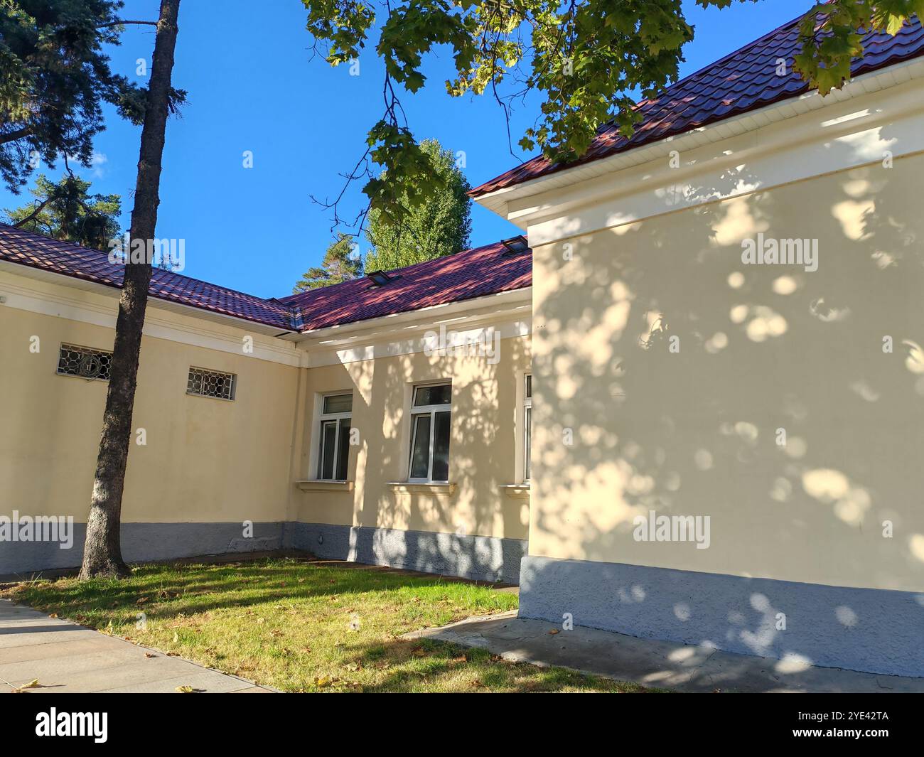 sturdy building with red brick columns and a sloping roof, set against ...