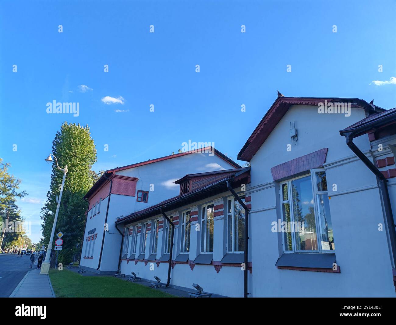 A vintage building with distinctive red brick columns and a spacious ...