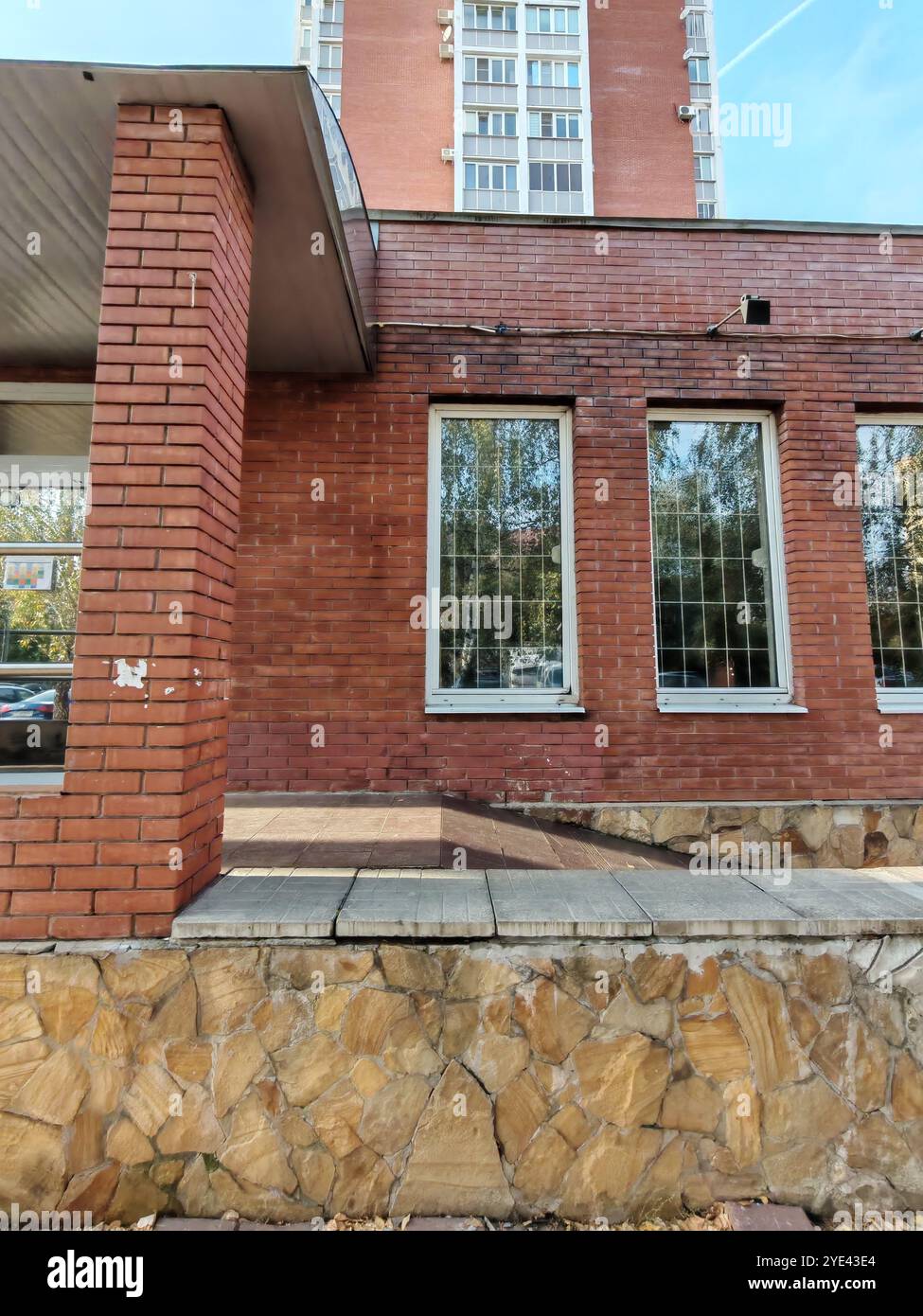brick building with alternating red and gray patterns, showcasing ...