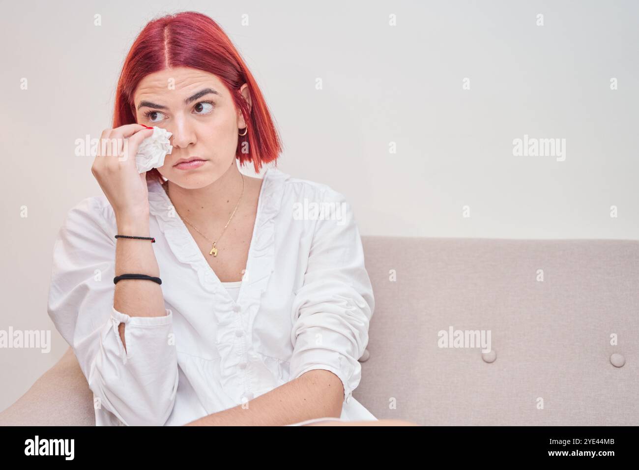 Woman crying wiping tears tissue hi-res stock photography and images ...
