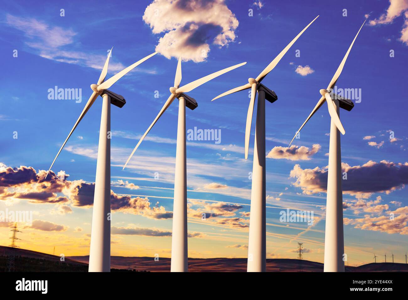 Wind mills farm and sunset landscape.Renewable energy and wind turbines ...