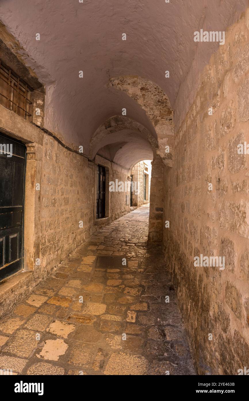Medieval stone arched corridor with a stone floor Stock Photo - Alamy