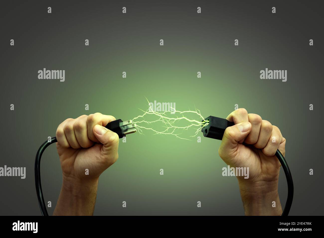 Hands Holding US Power Cable with Green Energy Stock Photo - Alamy