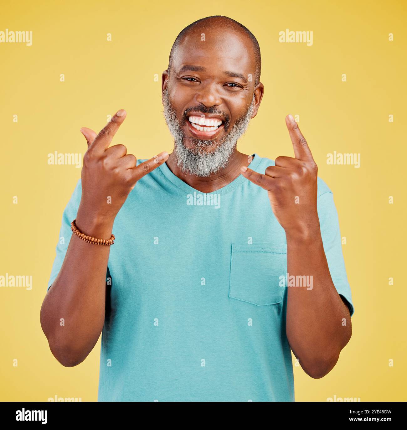 Horns hand gesture, portrait and senior black man in studio isolated on ...