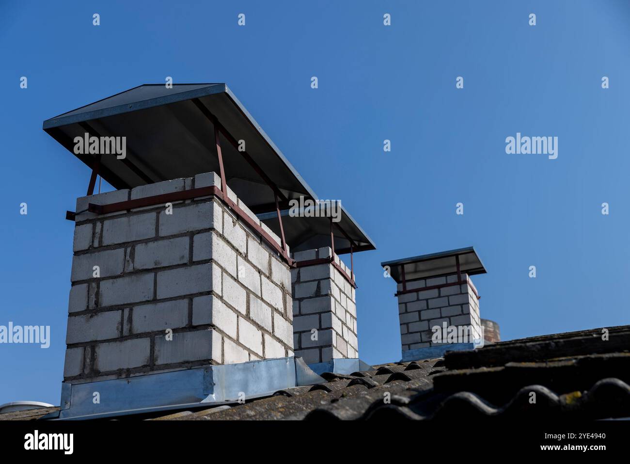 a chimney made of white brick in the house, several brick chimneys ...