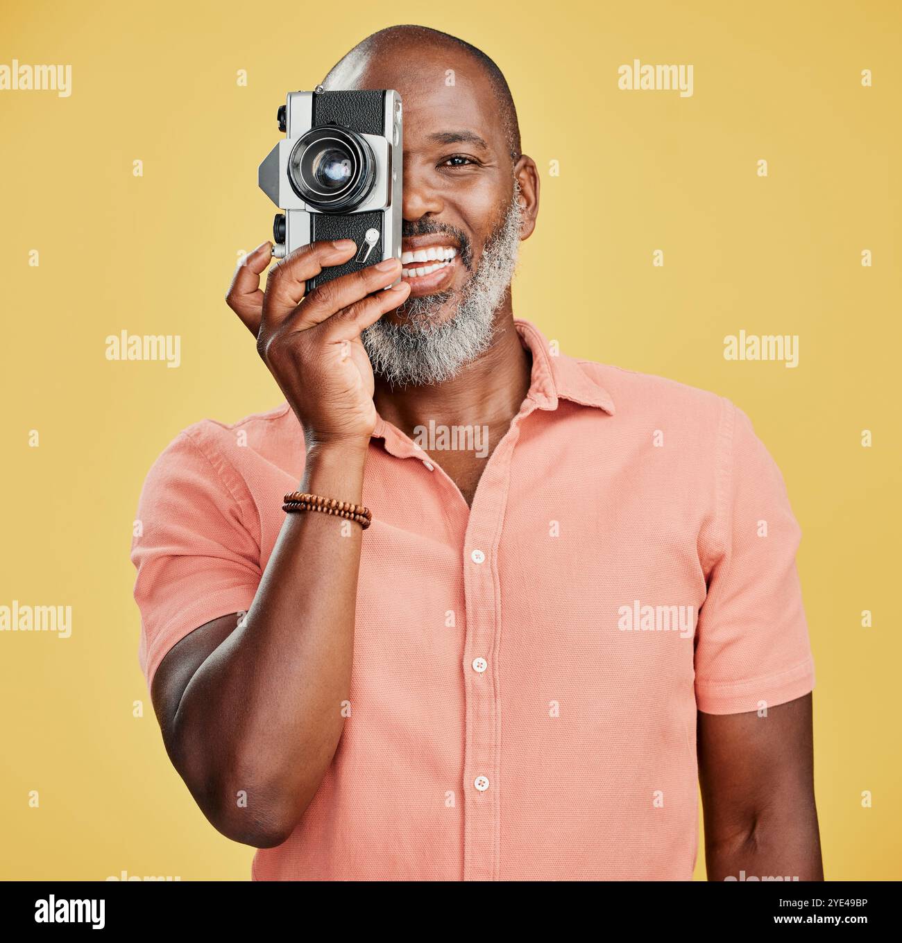Portrait, black man and camera in studio for photography, taking ...