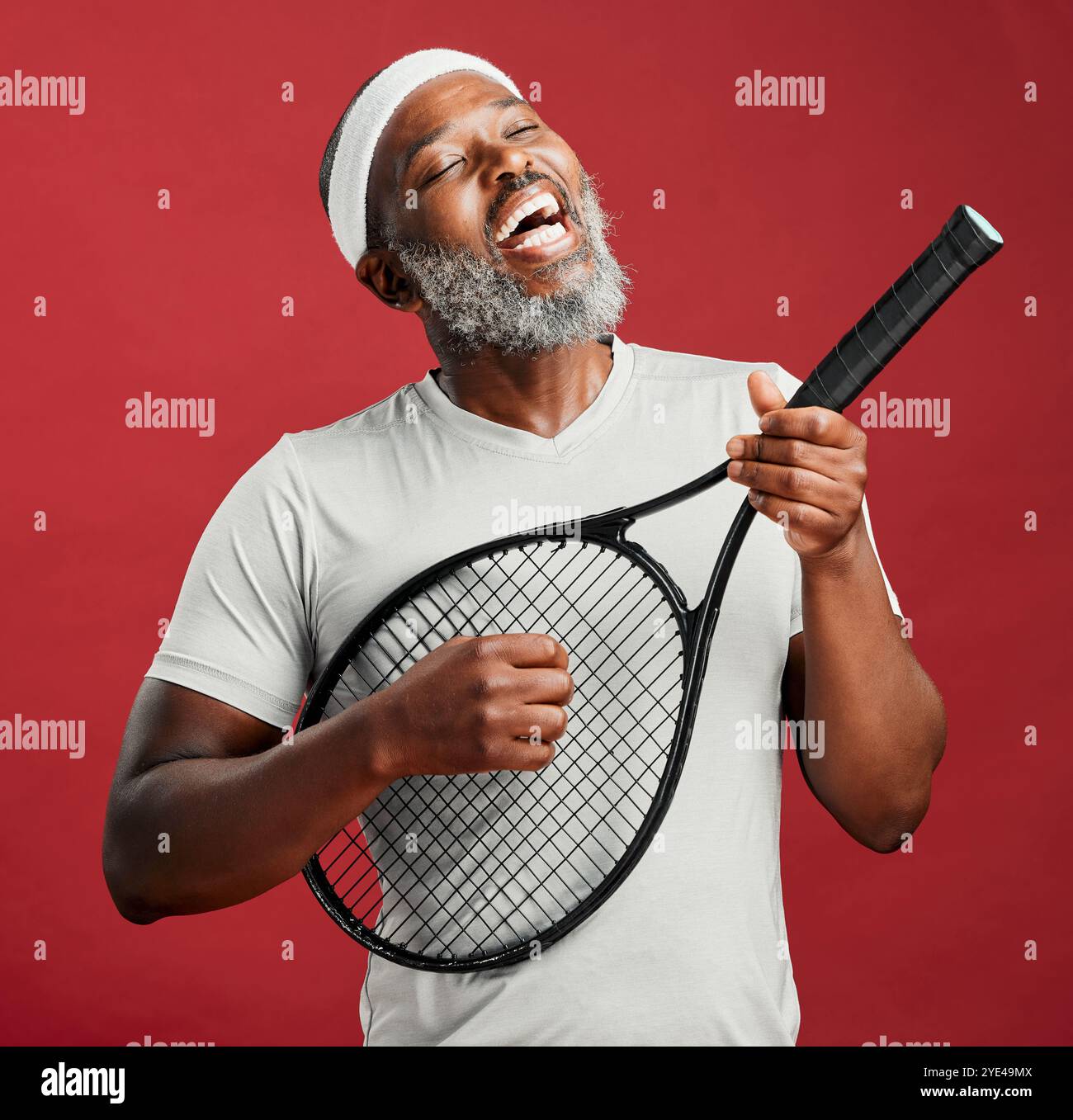 Happy, fitness and black man with racket, studio and silly with ...