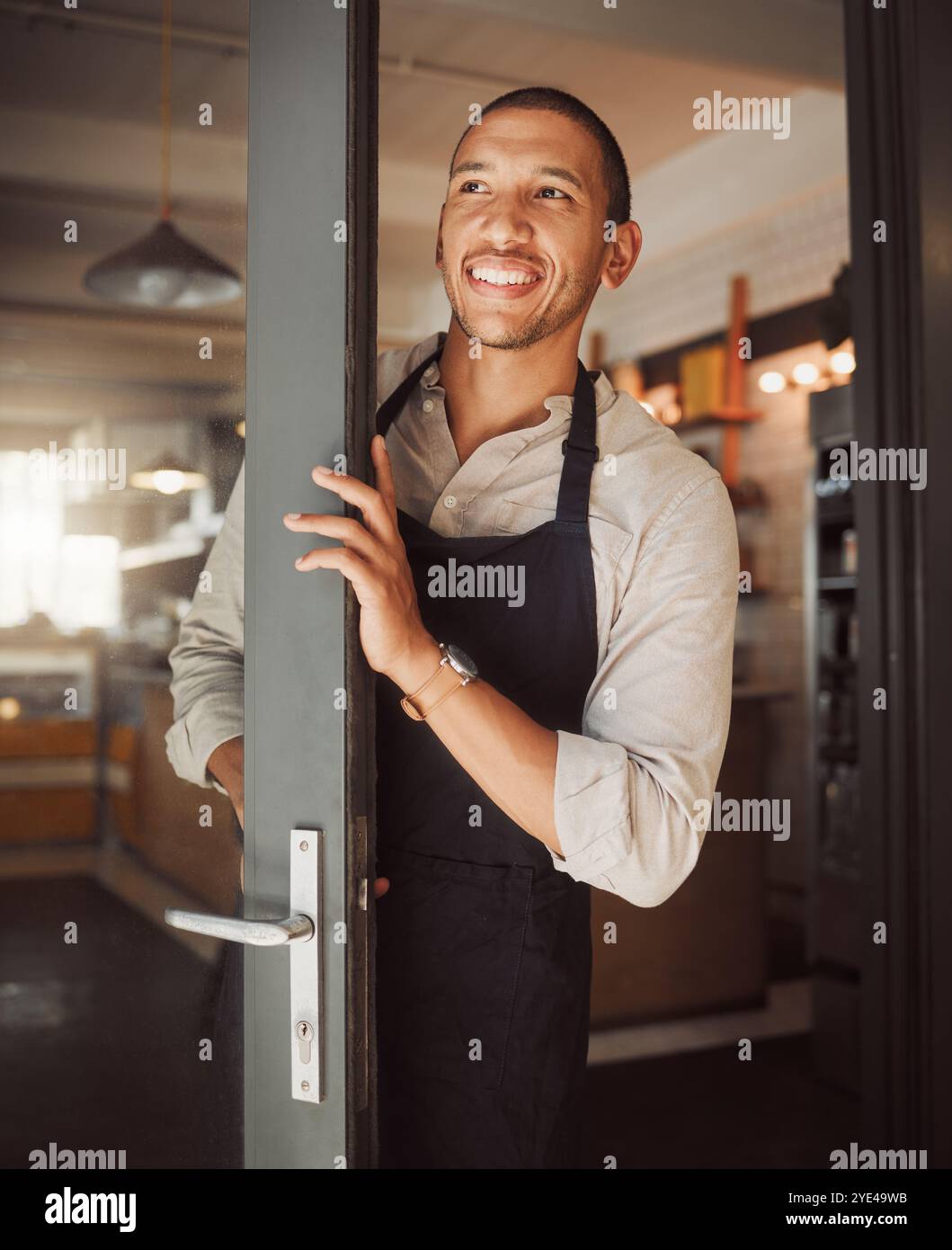 Happy, man and business owner at entrance of cafe with welcome ...