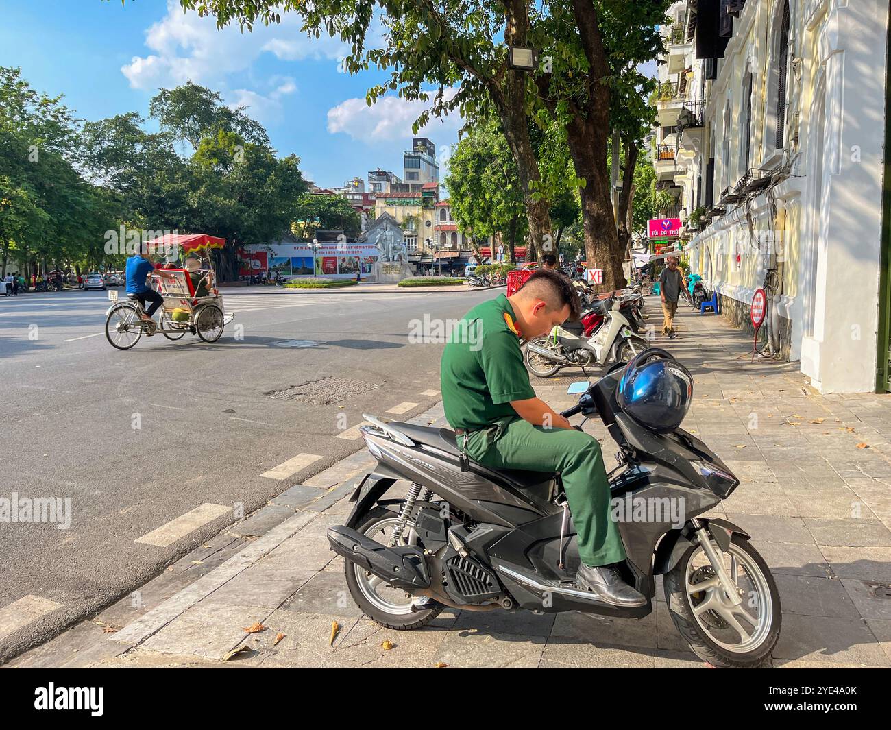Hanoi, Vietnam: daily life, soldier on a motorbike while traffic jam on ...