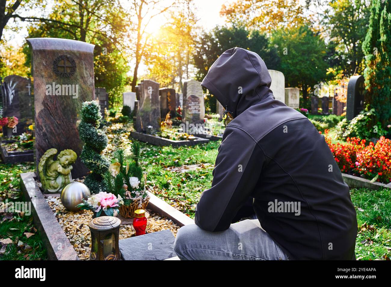 Bavaria, Germany - October 29, 2024: A young man mourns a deceased ...