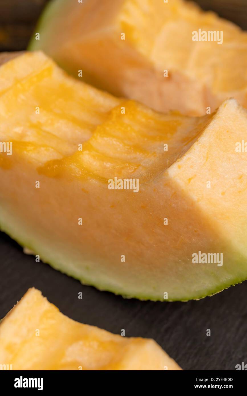 fresh melon cut into pieces, slicing sweet orange melon into pieces ...