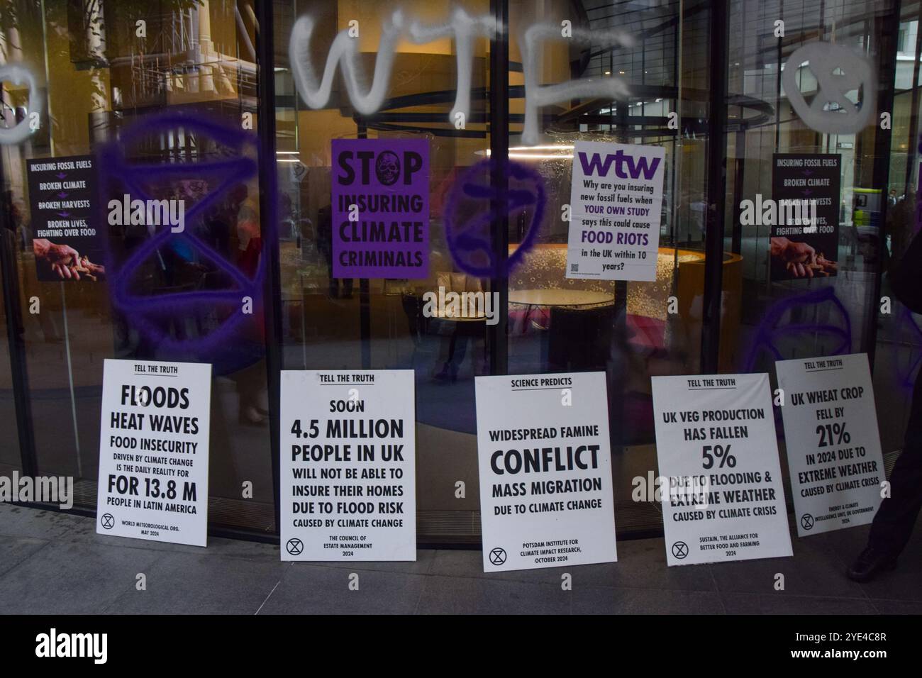 London, UK. 29th October 2024. Extinction Rebellion stick posters on ...