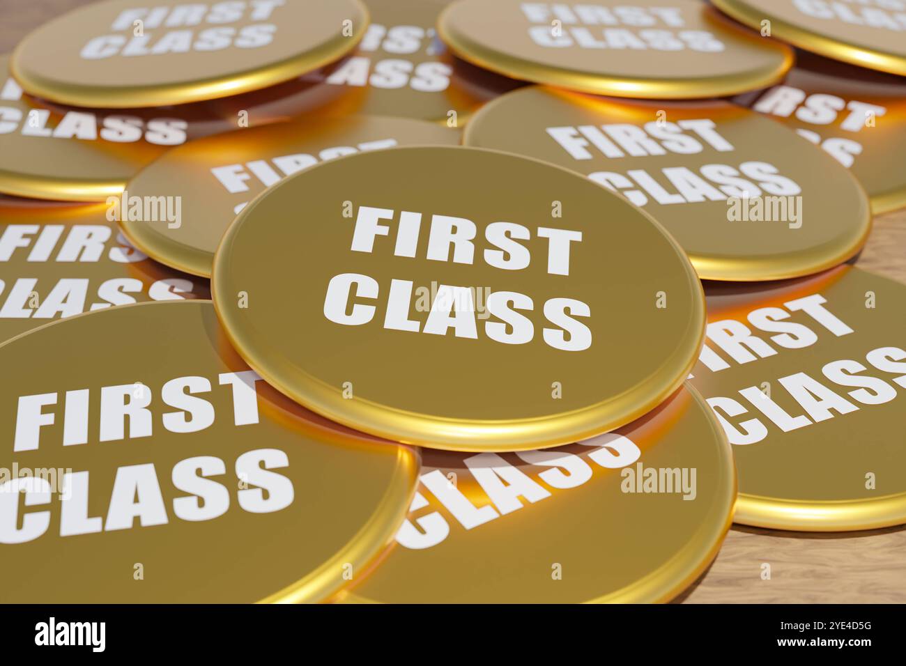 First Class. First Class. Golden badges laying on the table with the ...