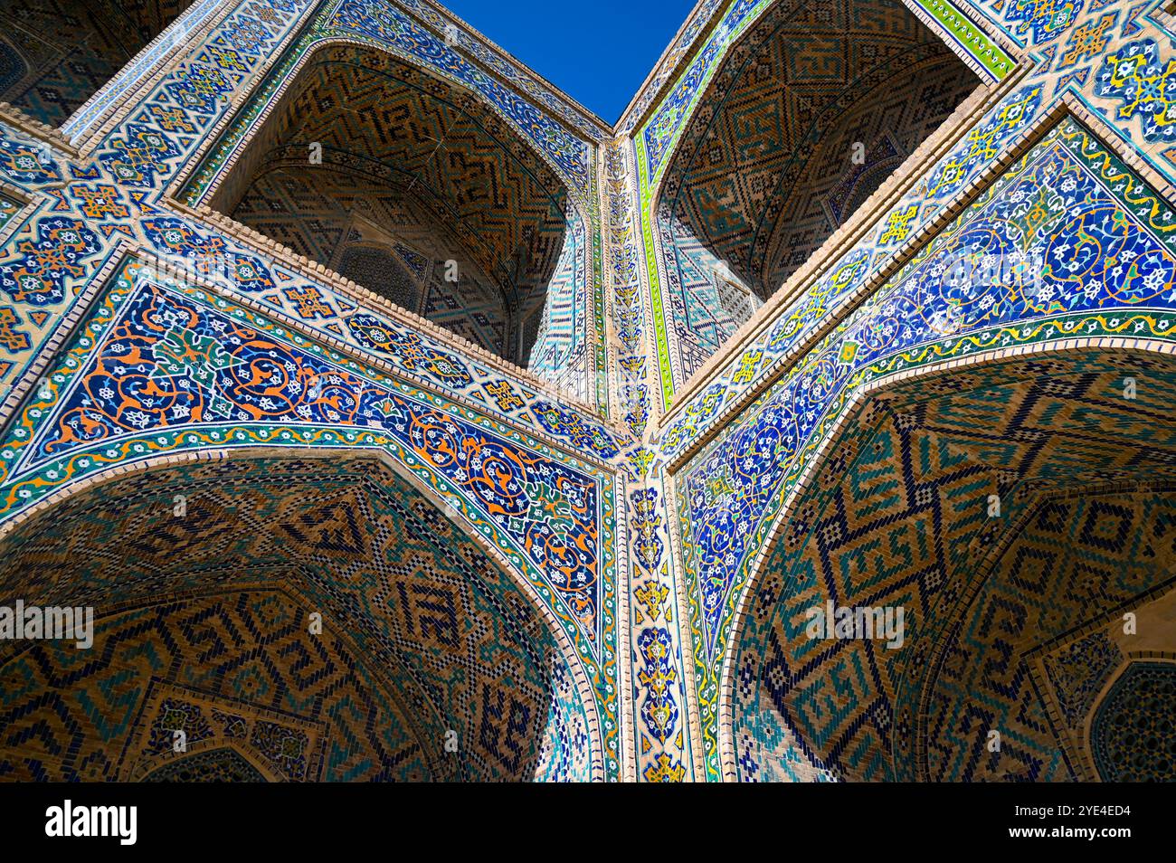 Courtyard of ancient building decorated by majolica tiles in Samarkand ...
