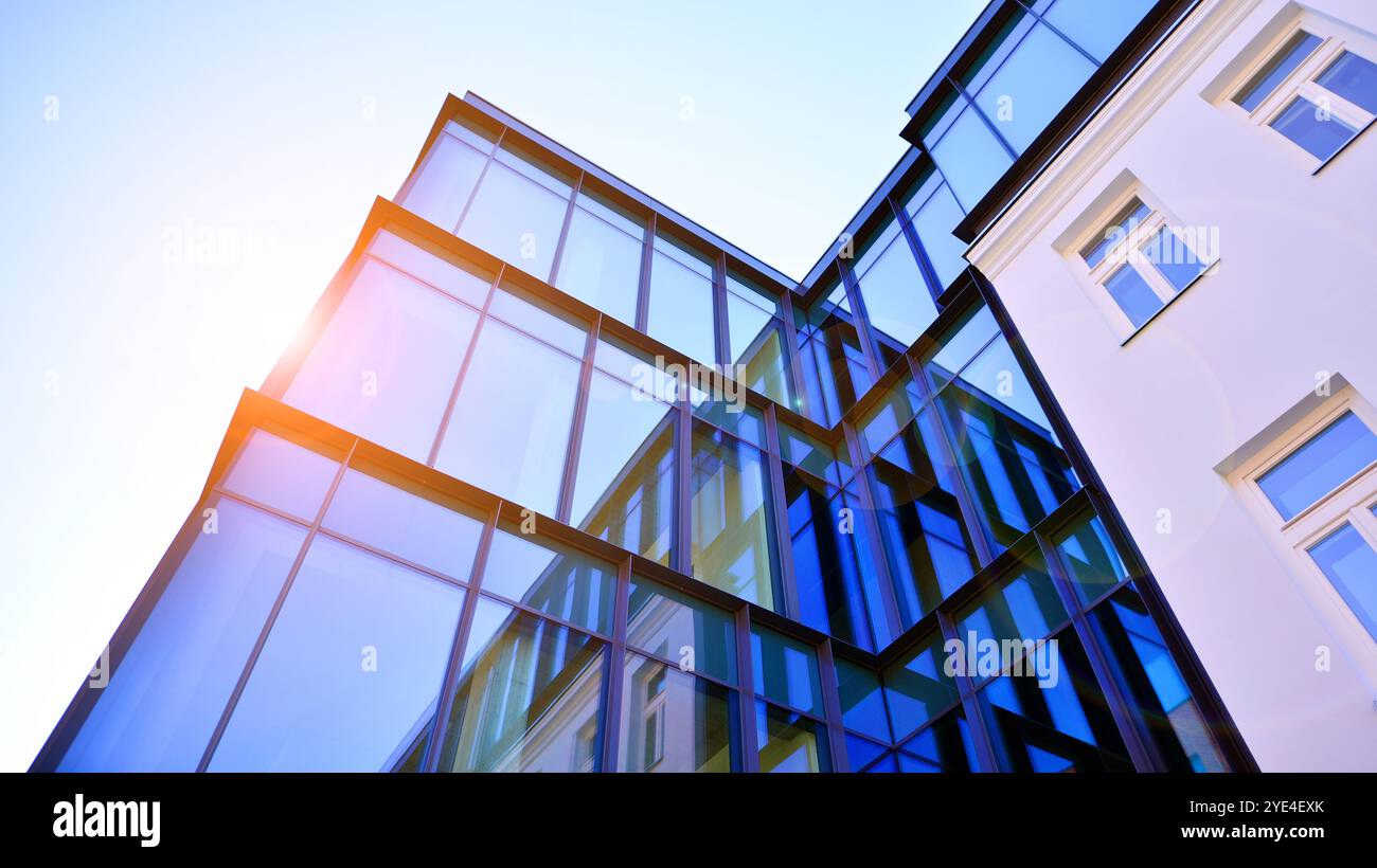 A renovation residential building and an adjacent modern office ...