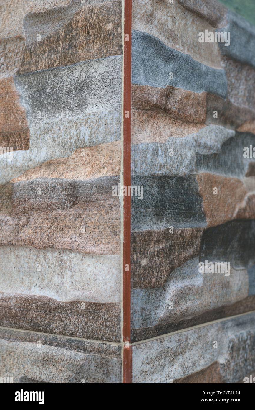 Close-up of multi colored stone tiles with varied textures. The earthy ...