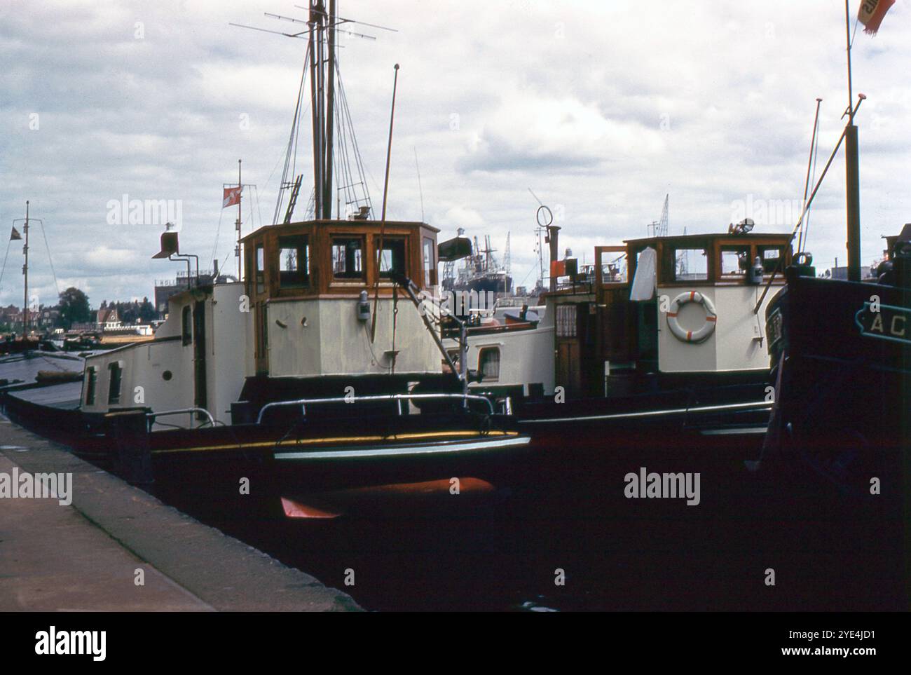 Amsterdam, Netherlands. August 1961 – A view of barges moored at ...