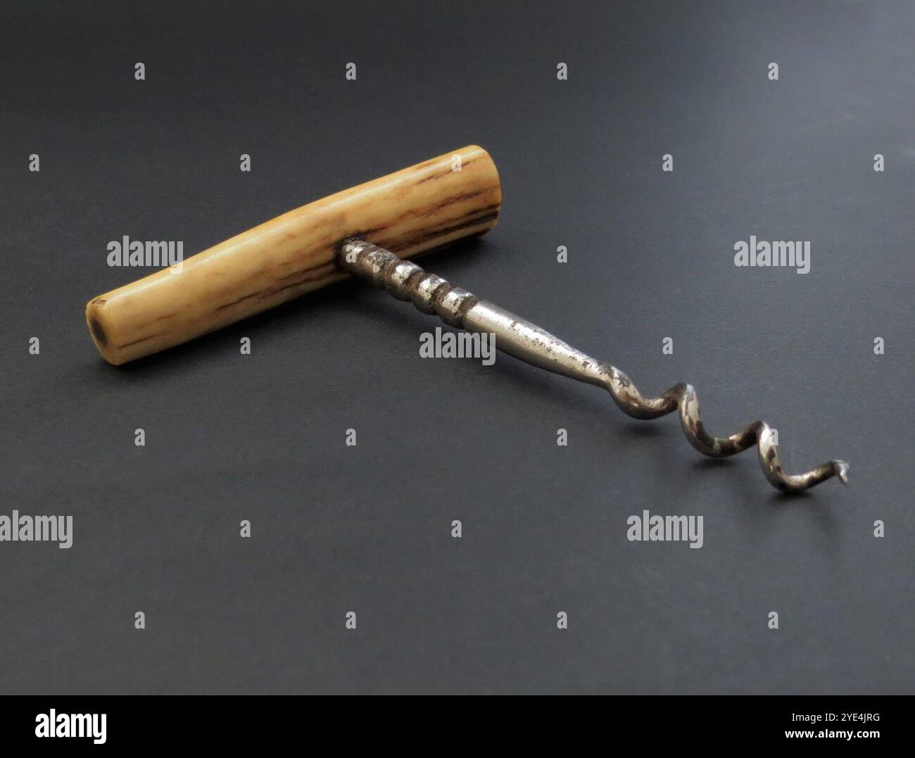 An antique straight-pull corkscrew with a roe deer antler handle ...
