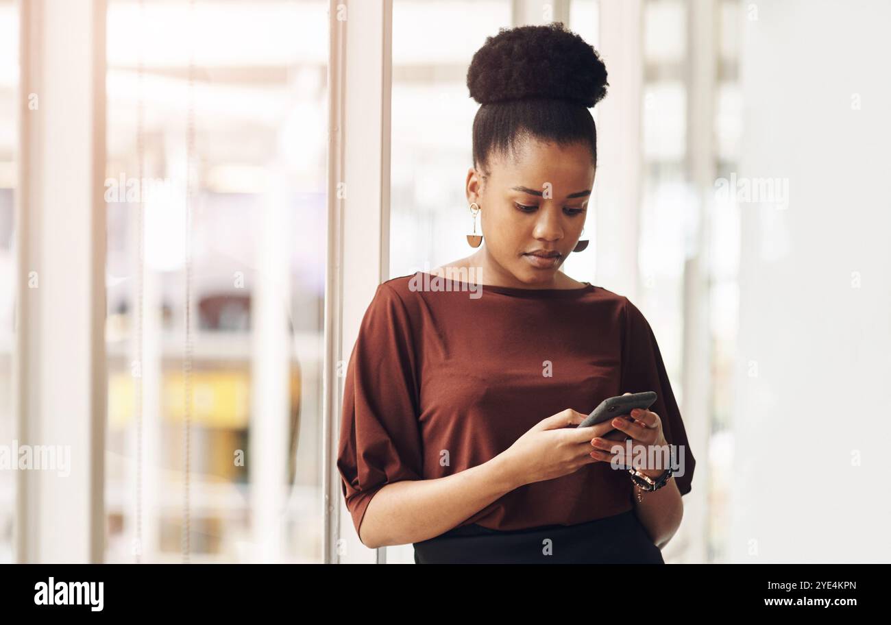 Black woman, phone and typing email in office, reading and journalist ...