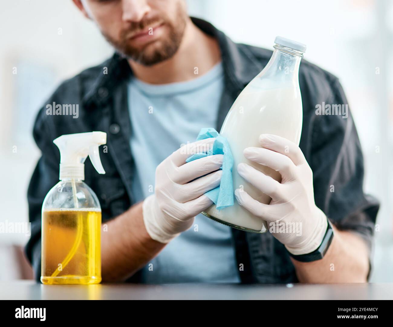 Hands, cleaning and wipe bottle of milk for health, ocd and virus ...