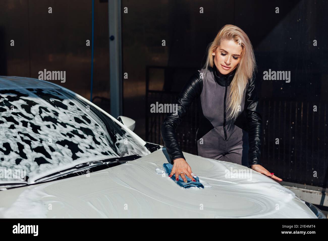 Female washing car at car wash Stock Photo - Alamy