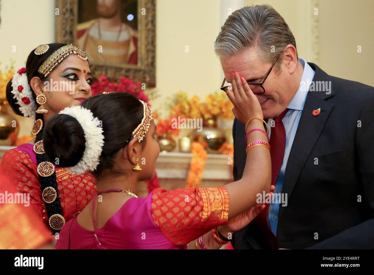 Prime Minister Sir Keir Starmer has a tilak applied by a member of the ...