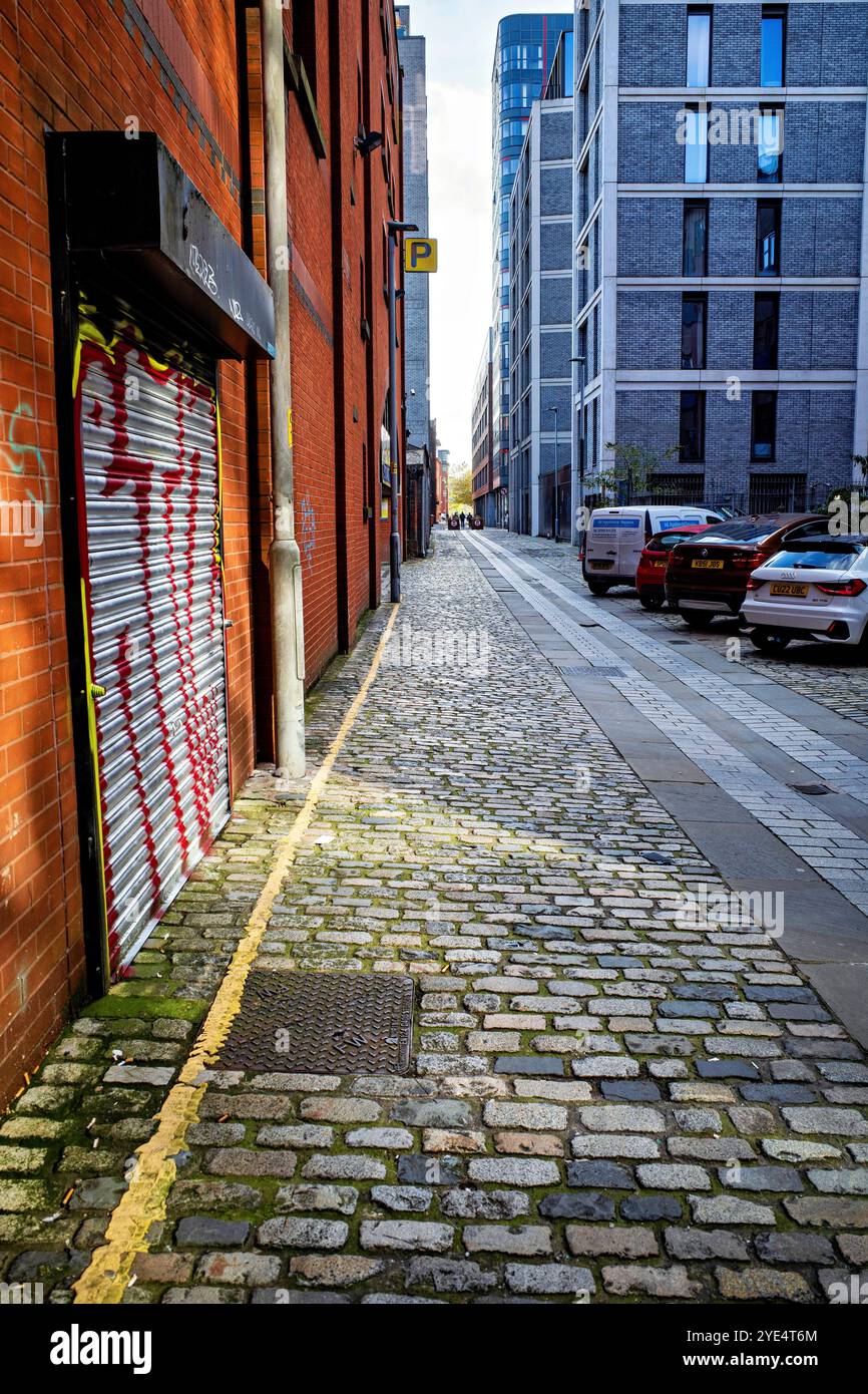 Manchester, UK. October, 26, 2024: Quiet urban alley with cobblestone ...