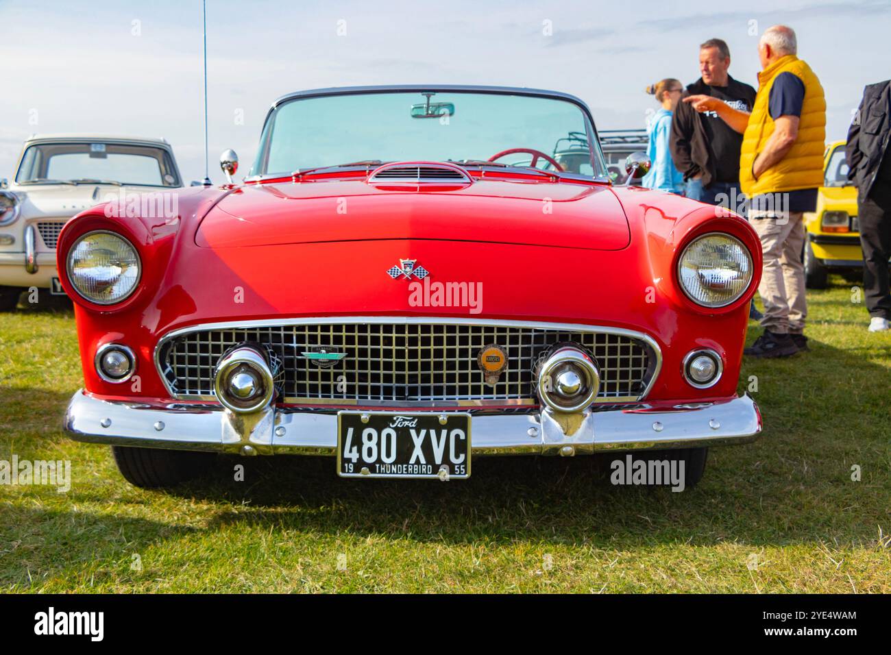 A bright red vintage convertible Ford Thunderbird at classic car show ...