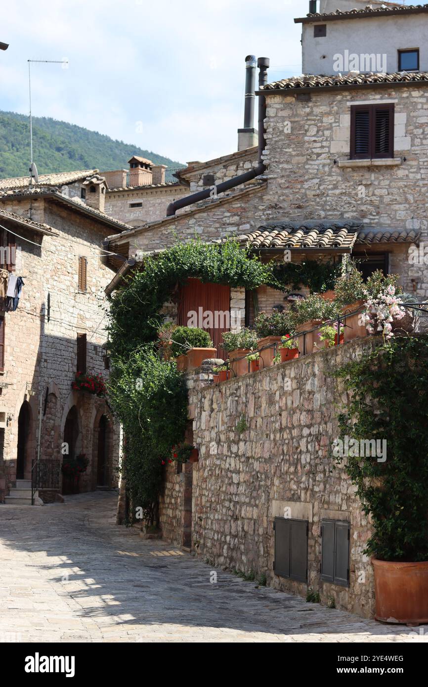 View along a narrow back street in an old town Stock Photo - Alamy