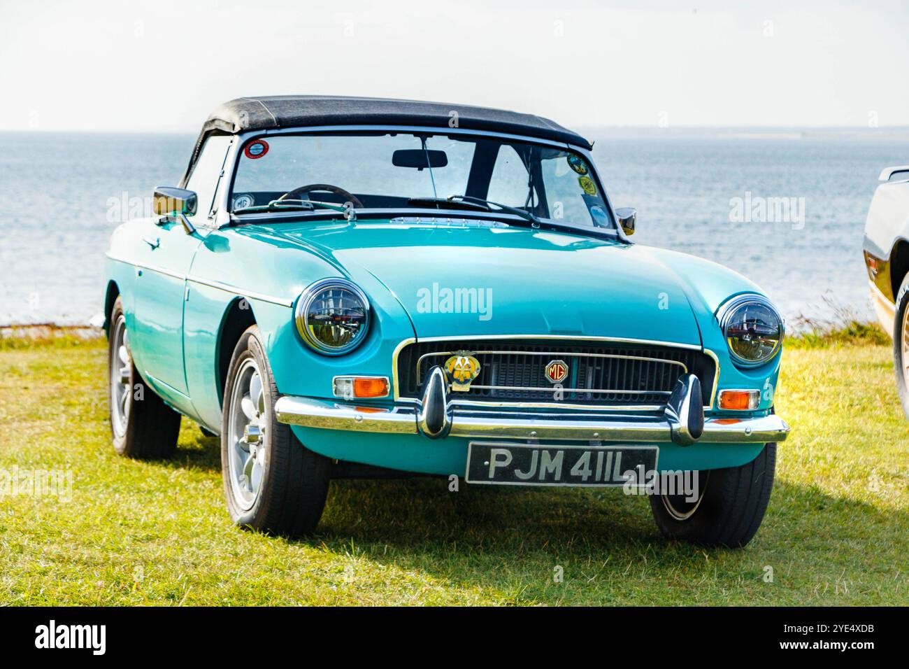 Vintage light blue 1972 MG convertible on display by the seaside ...