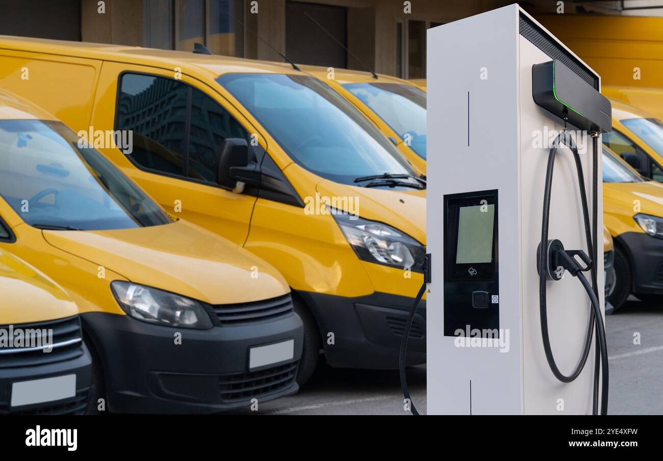 Electric delivery vans with electric vehicles charging station Stock ...