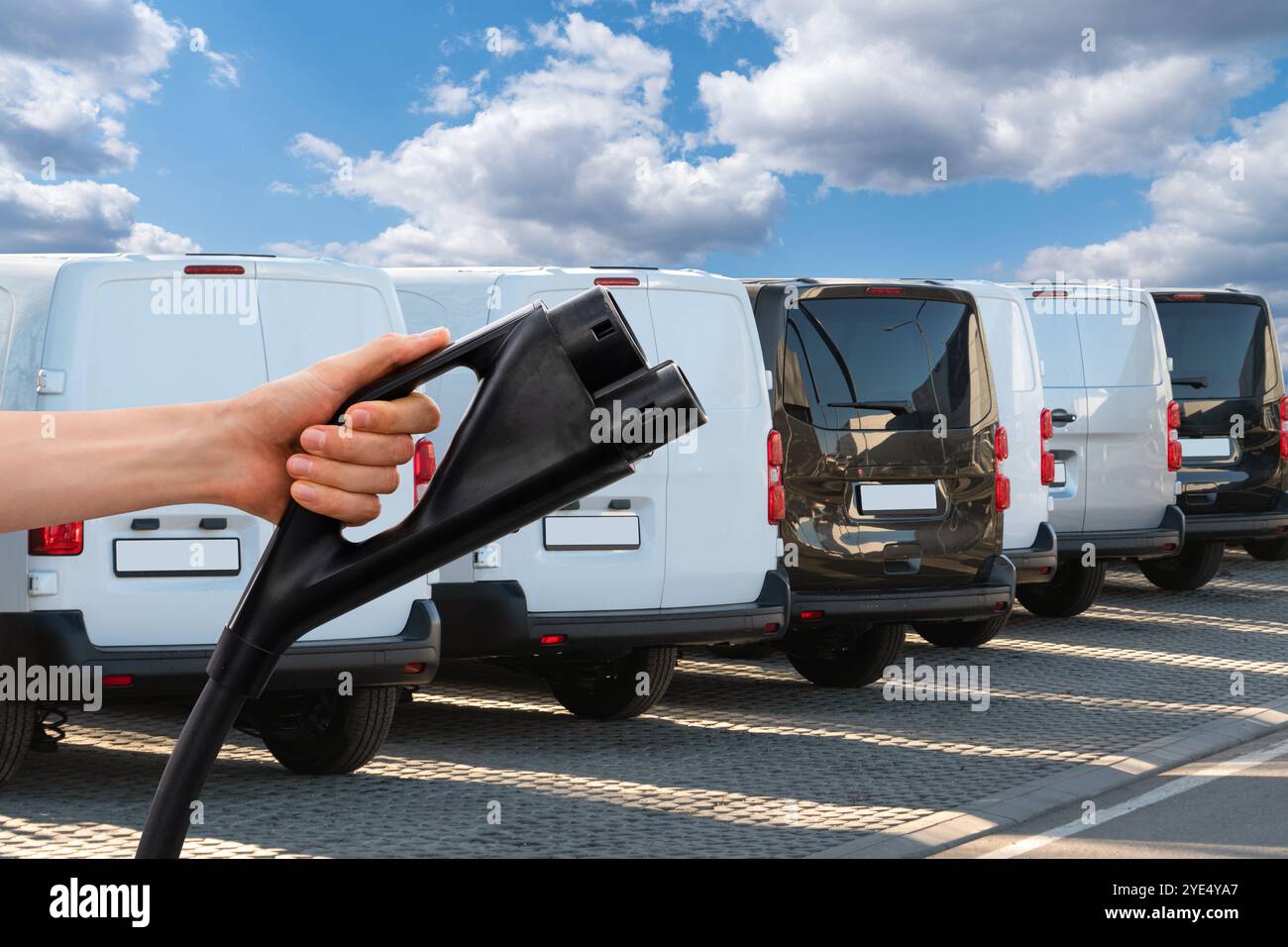 Electric delivery vans with electric vehicles charging station Stock ...