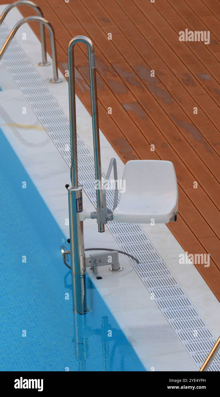 handicapped chair to enter the swimming pool Stock Photo - Alamy