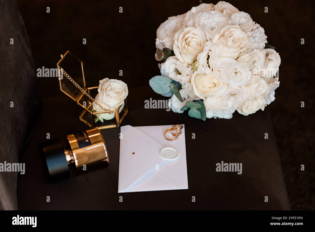 Elegant Wedding Essentials: A Bridal Bouquet, Engagement Rings, and ...