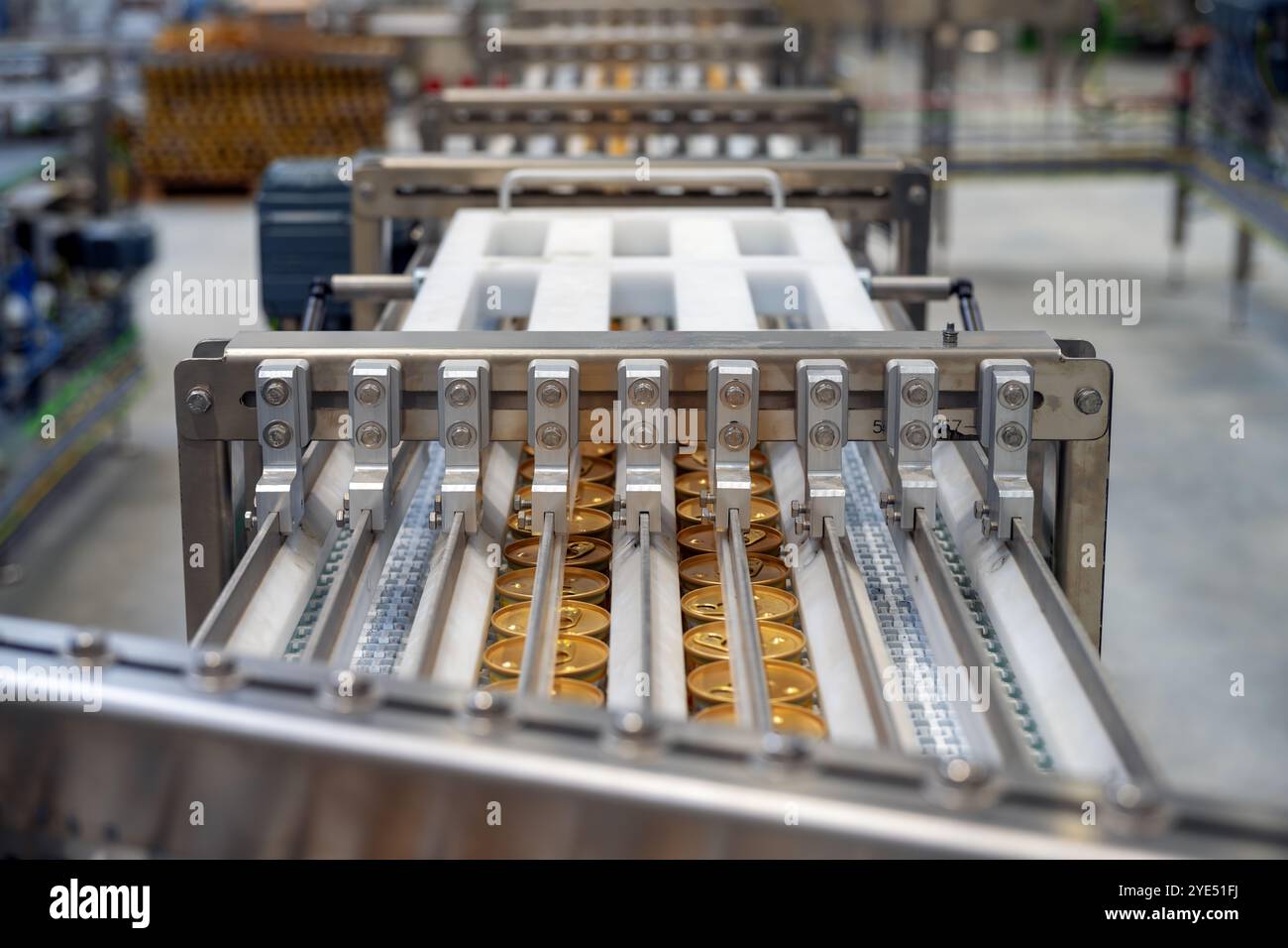 Hygienic chain conveyor with canned food close up photograph in food ...