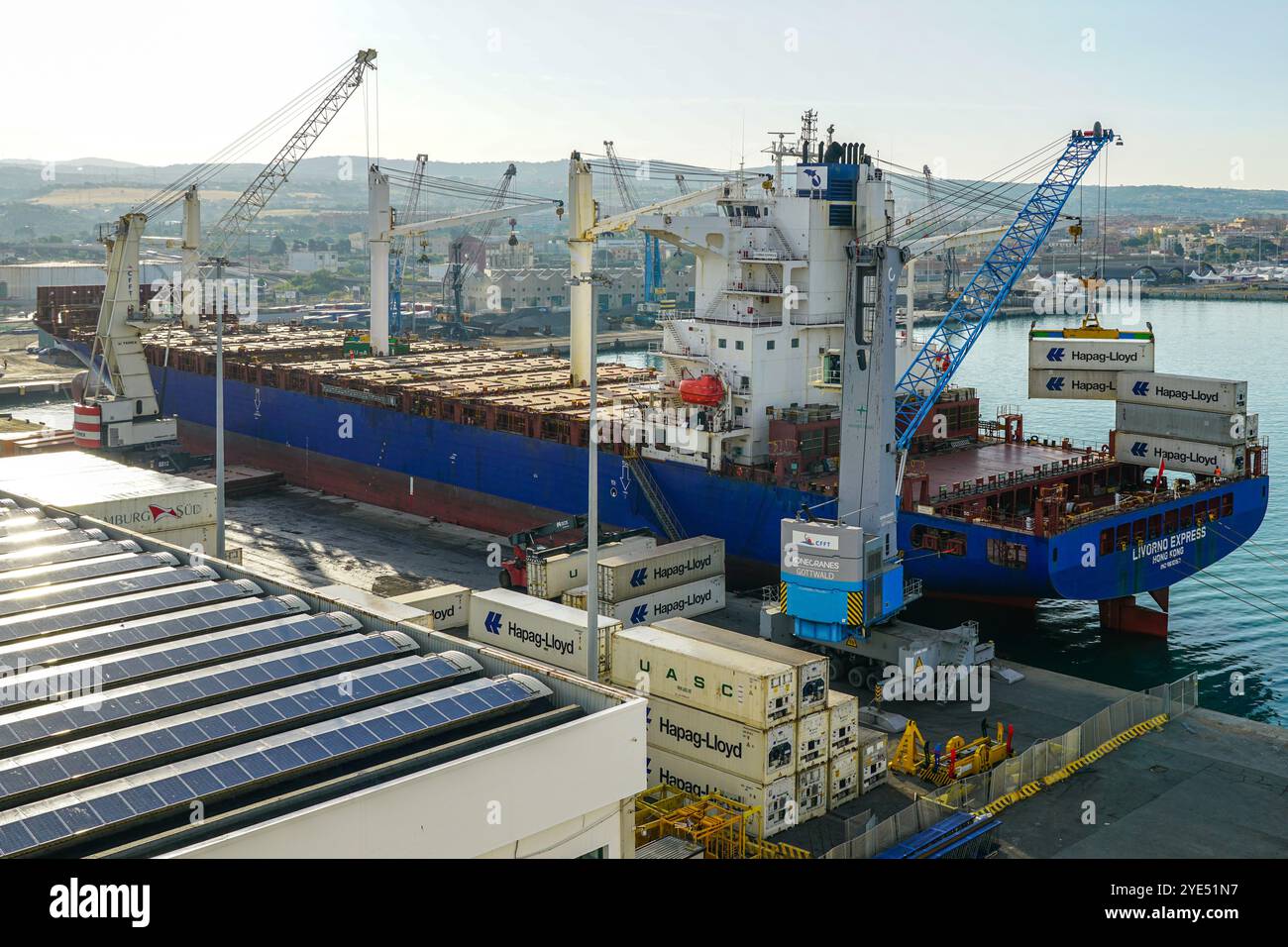 Civitavecchia, Italy- May 29, 2024: Port crane places Hapag-Lloyd cargo ...