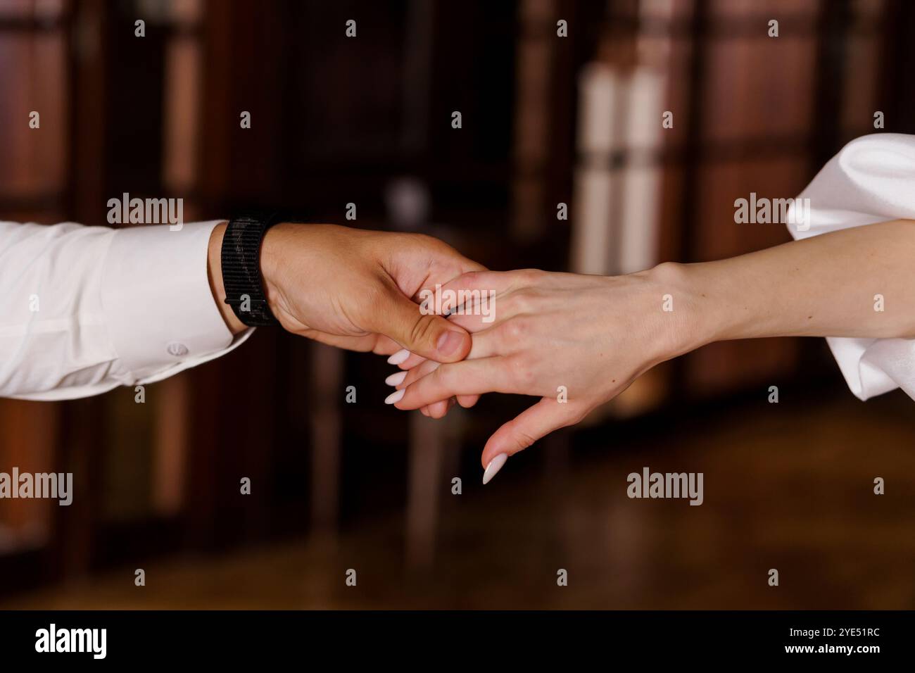 Romantic Connection: A Close-Up of Interlocked Hands Symbolizing Love ...