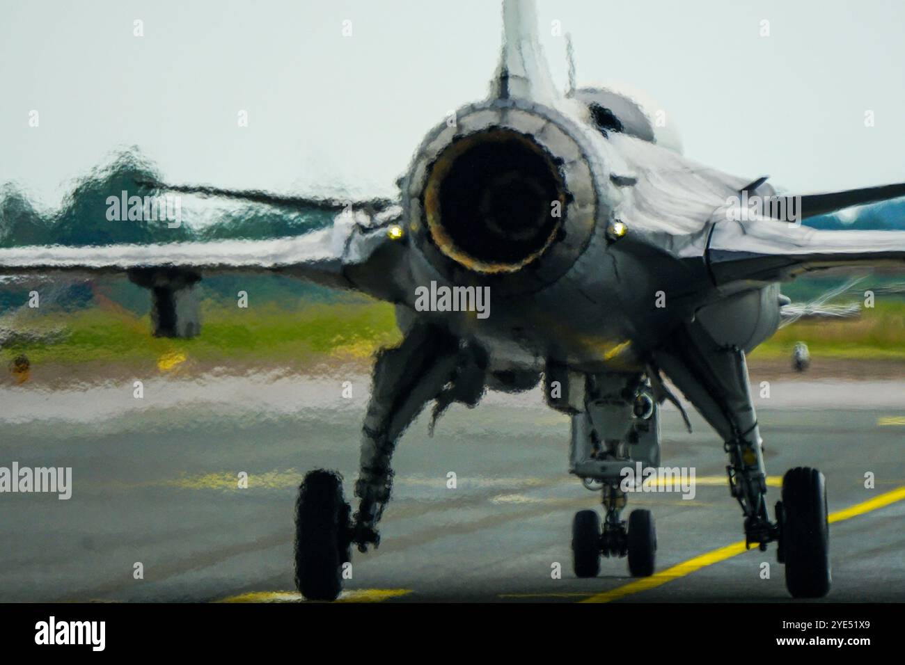 Swirling hot air behind the turbine exhaust of a working fighter jet ...